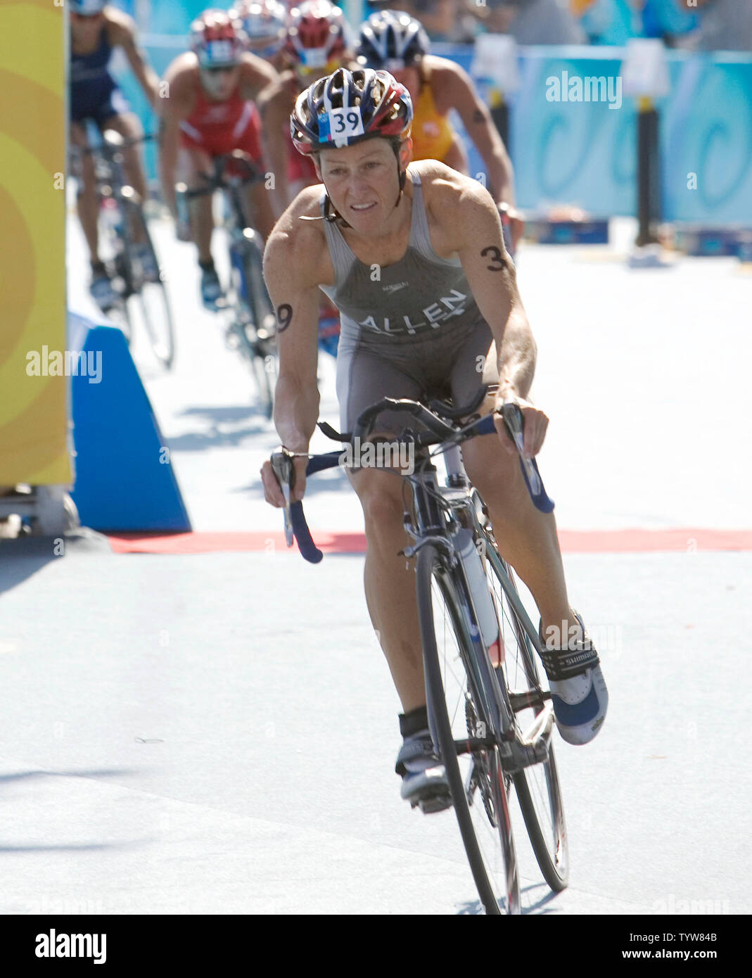 Kate Allan of Austria cycles through the transition going on to win ...