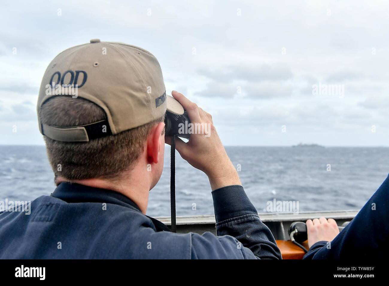 OCEAN (November 30, 2016) - Lt. j.g. Ian Haskins uses binoculars to ...
