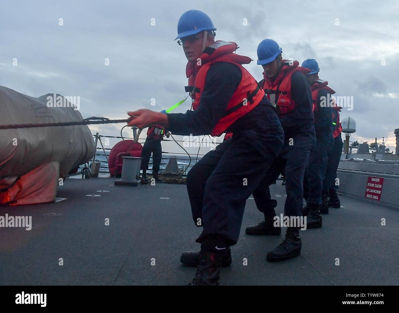 OCEAN (November 30, 2016) - Sailors handle a tending line during a ...