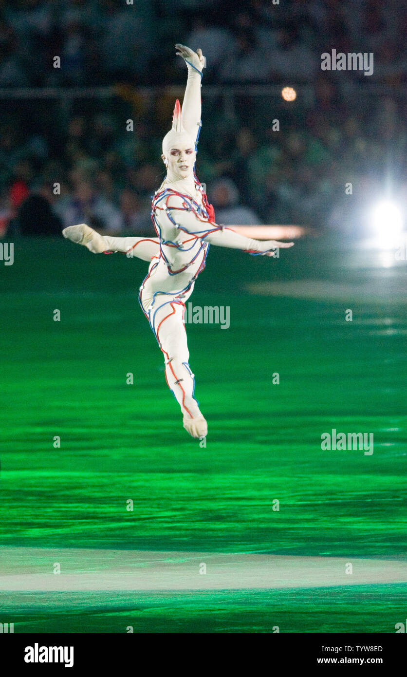 An acrobatic dancer performs in the Olympic Stadium during the Opening ...