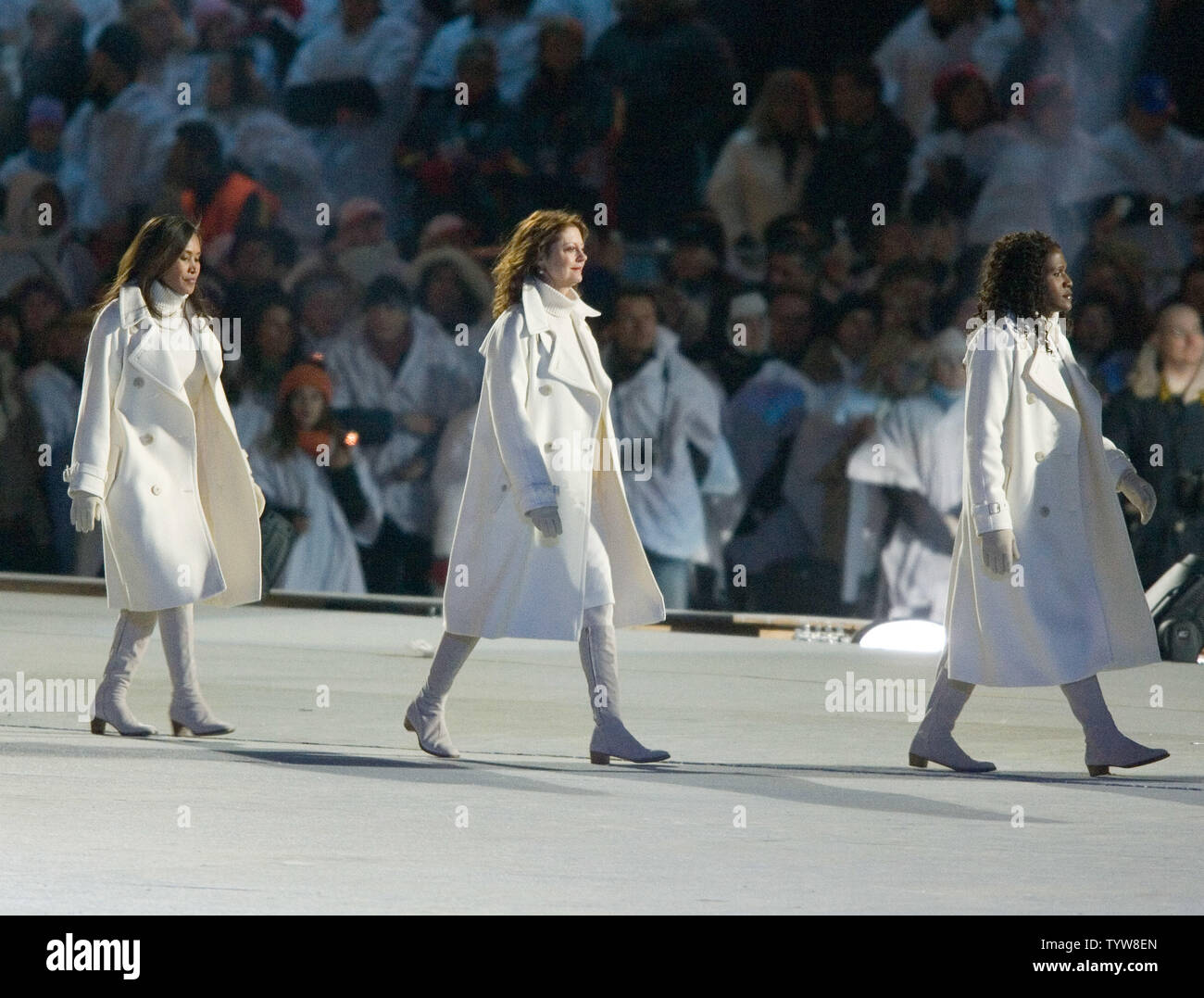 Actress Susan Sarandon (center) leaves the field after helping to carry ...