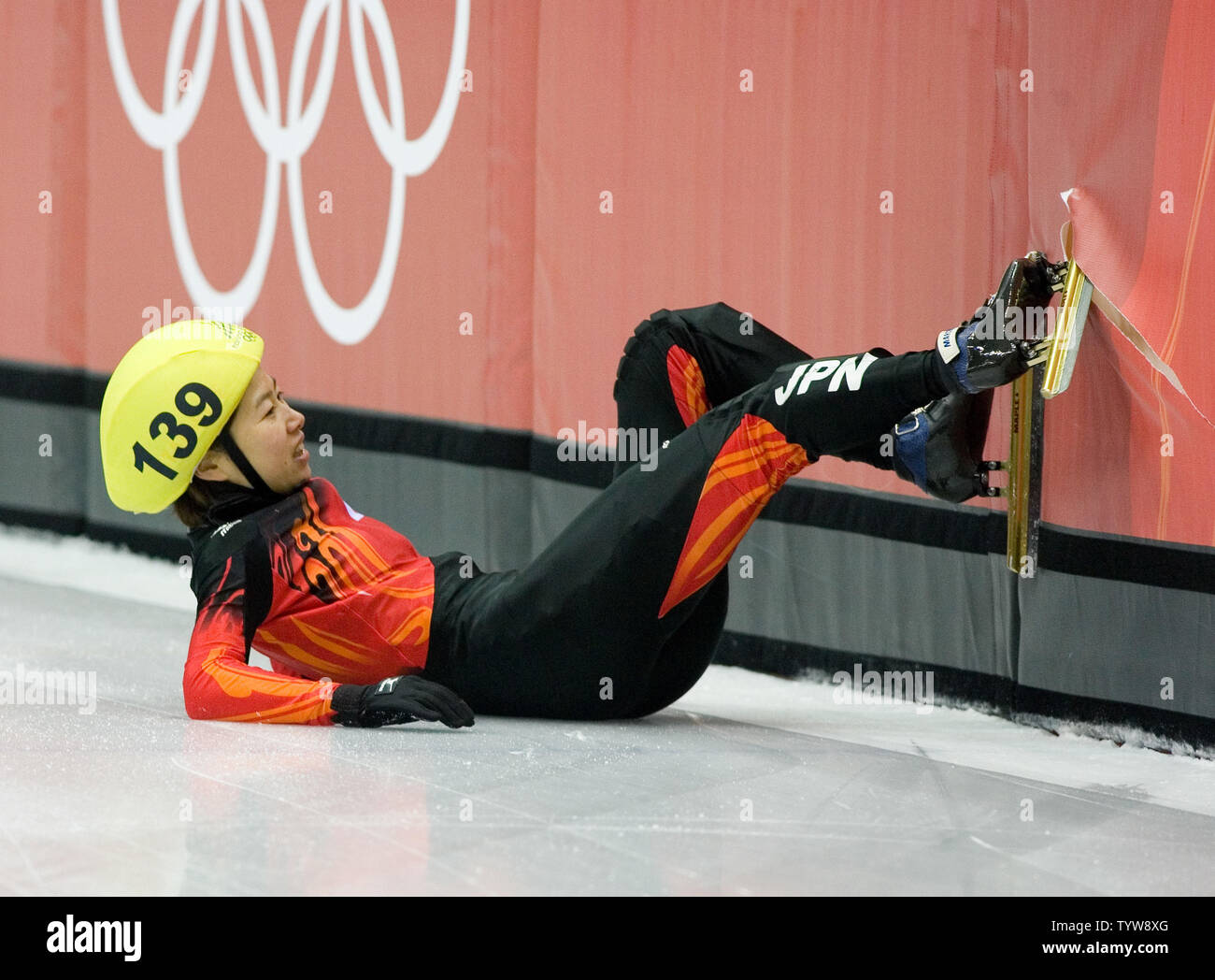 Japan's Nobuko Yamada slides into the wall taking her team out of ...