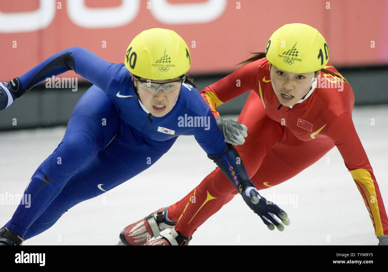 Team China's Xiaolei Cheng pushes off of Korea's Chun-Sa Byun through the first corner in women ...
