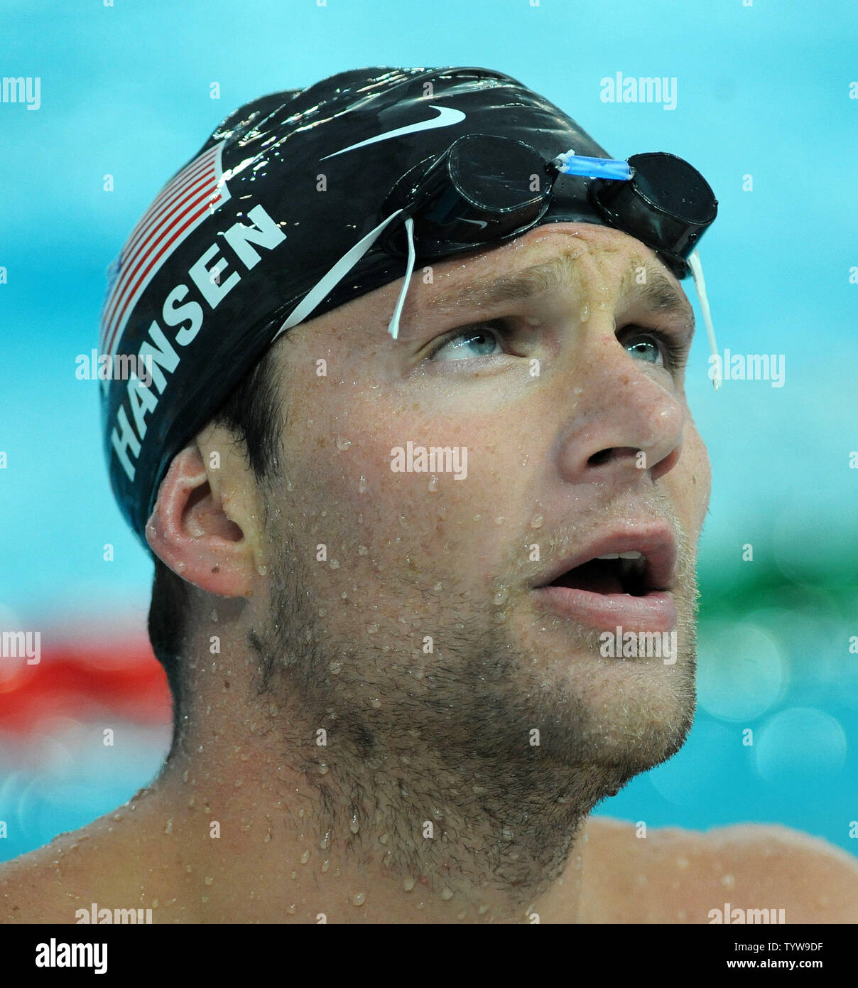 Brendan Hansen of the USA Swim Team listens to a coach during practice ...