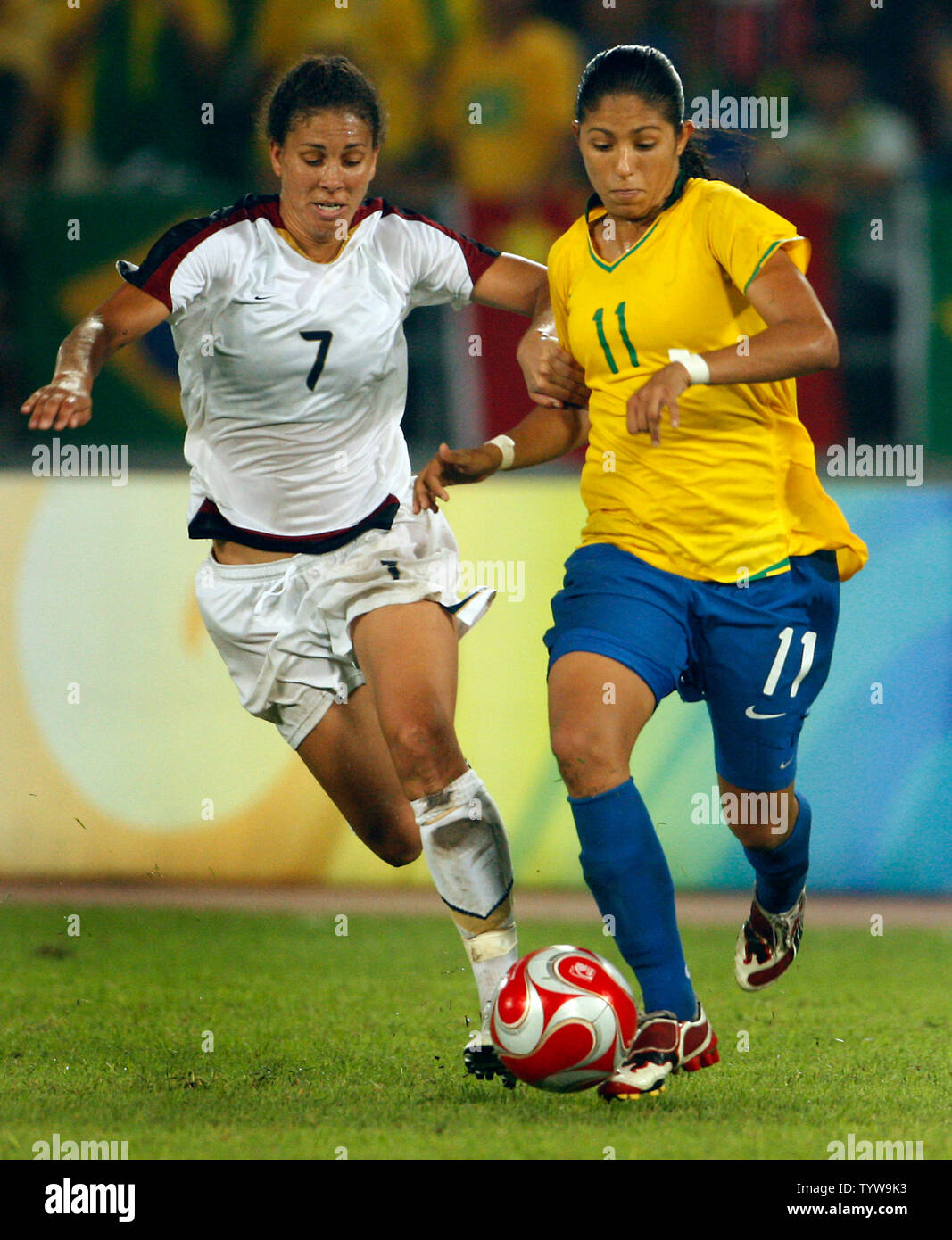 USA's Shannon Boxx (L) and Brazil's Cristiane fight for the ball in the ...