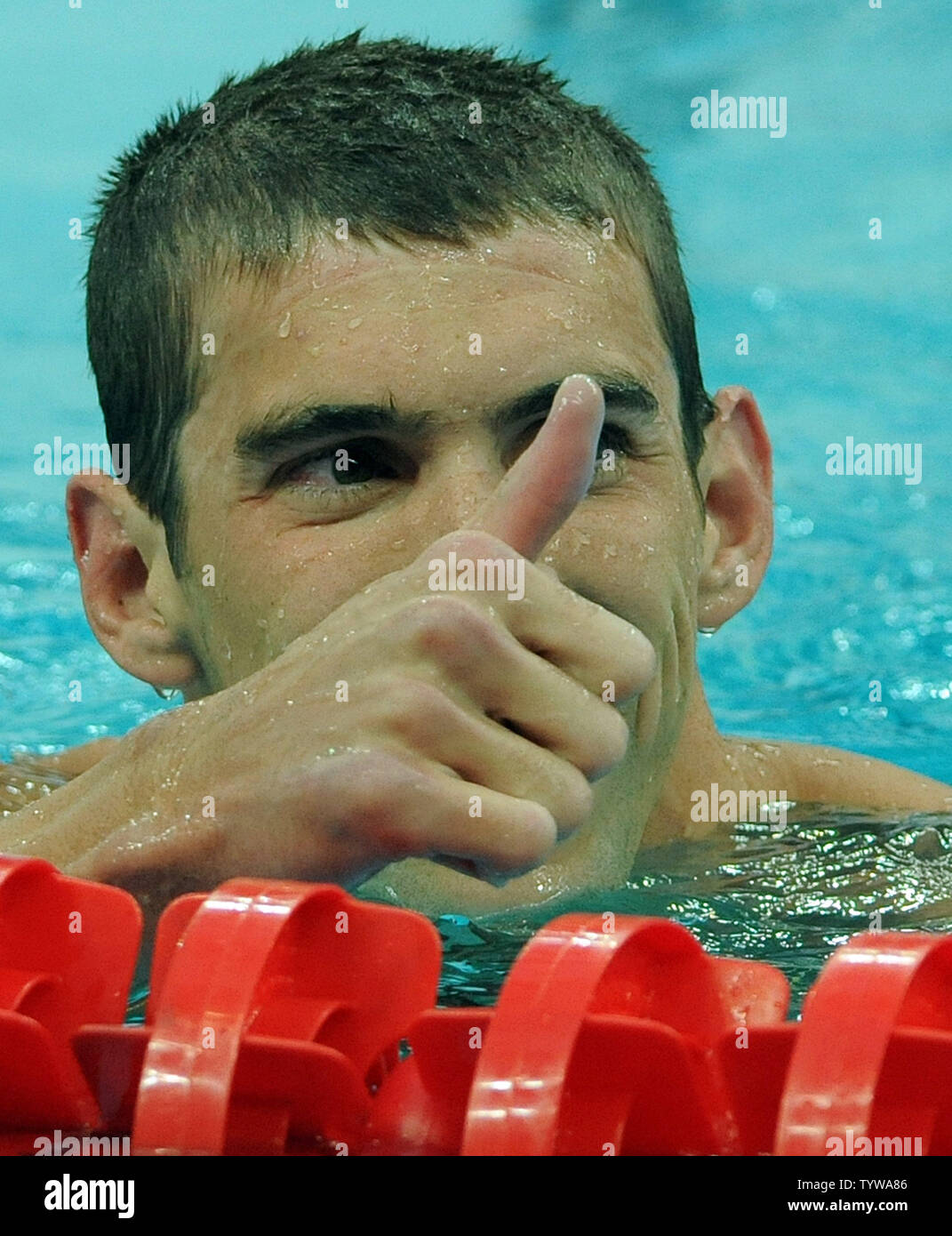 USA's Michael Phelps smiles and gives a thumbs up in the direction of U ...