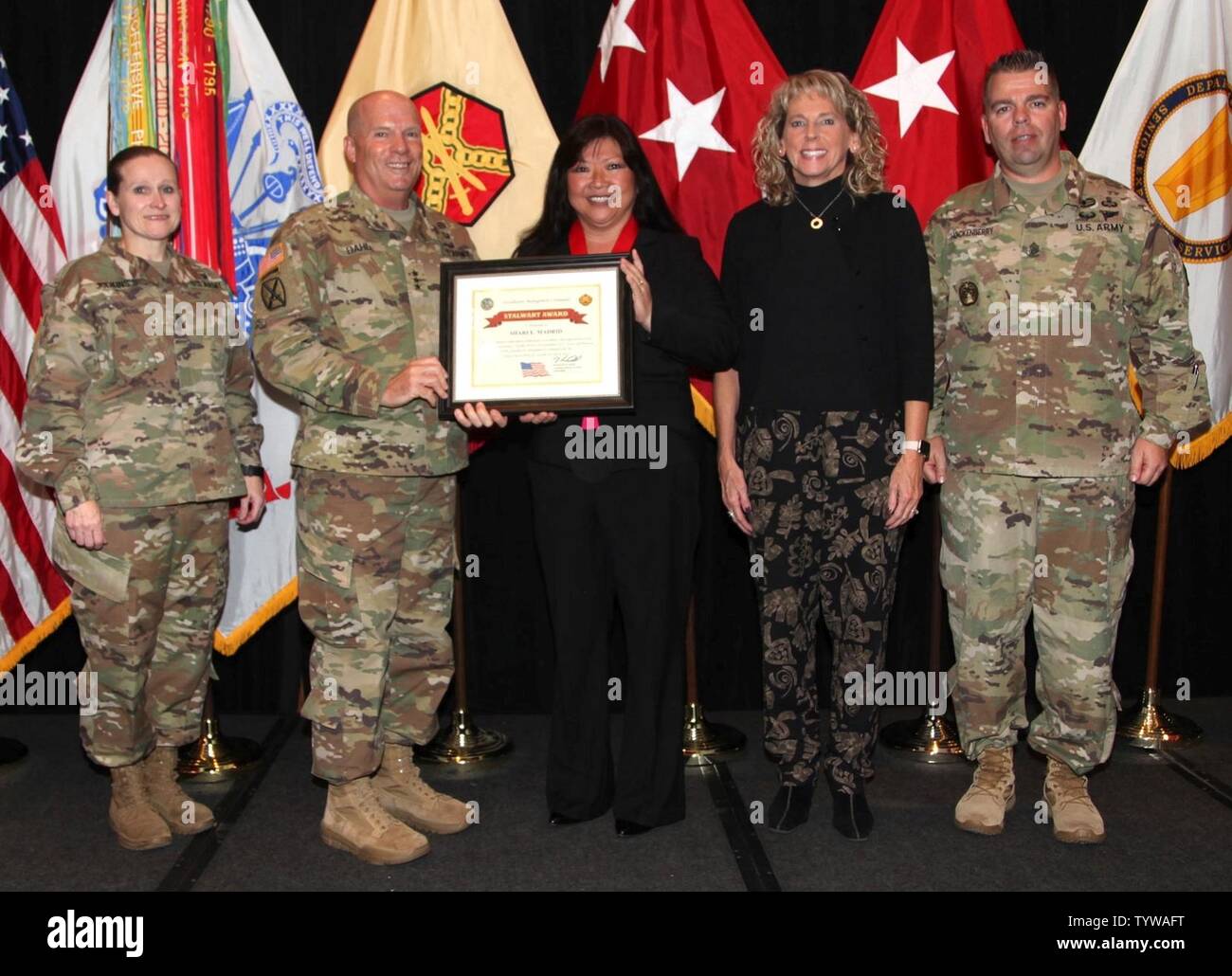 Shari Madrid, center, head of USAG-HI's Resource Management Office, won ...