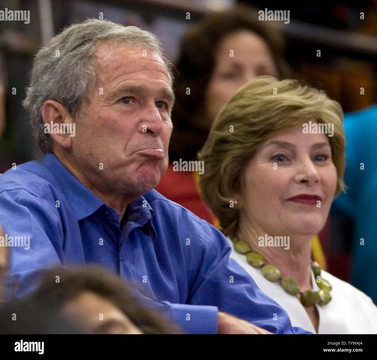 U.S. President George W. Bush (L) and his wife Laura watch USA and ...
