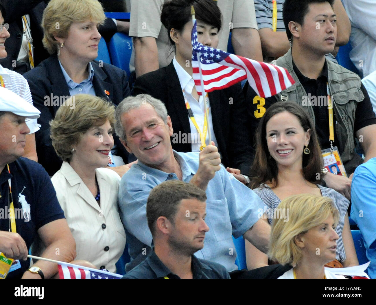 United States President George W. Bush enjoys the swimming events with ...