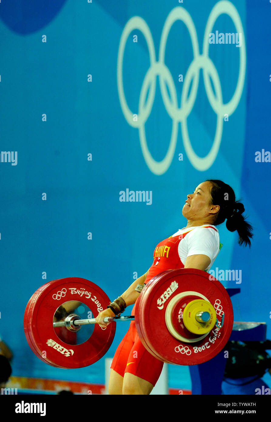 Chinese weightlifter Chen Yanqing begins her lift of 138 KG to set a ...