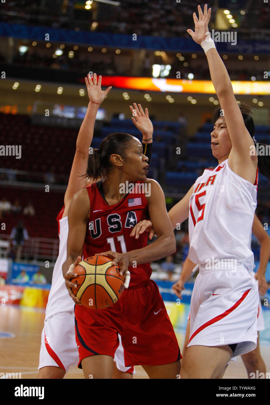 USA's Tina Thompson (11) is guarded by Chen Nan (15) of China at the ...
