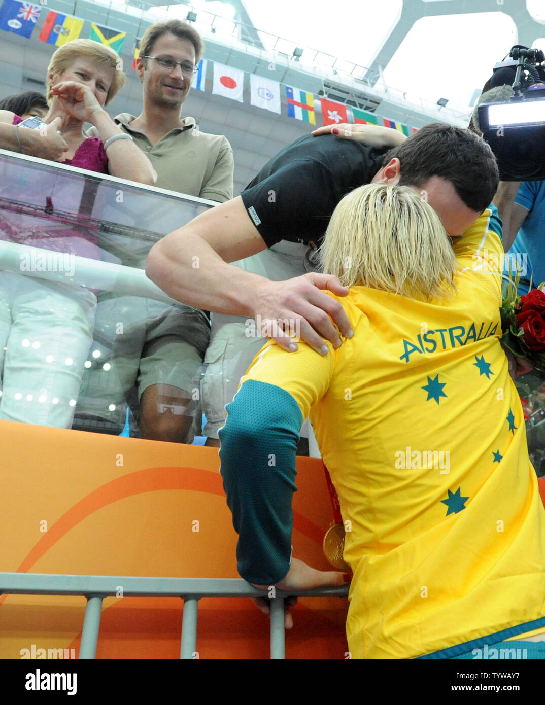Australia's gold medal winner Leisel Jones goes into the crowd to hug ...