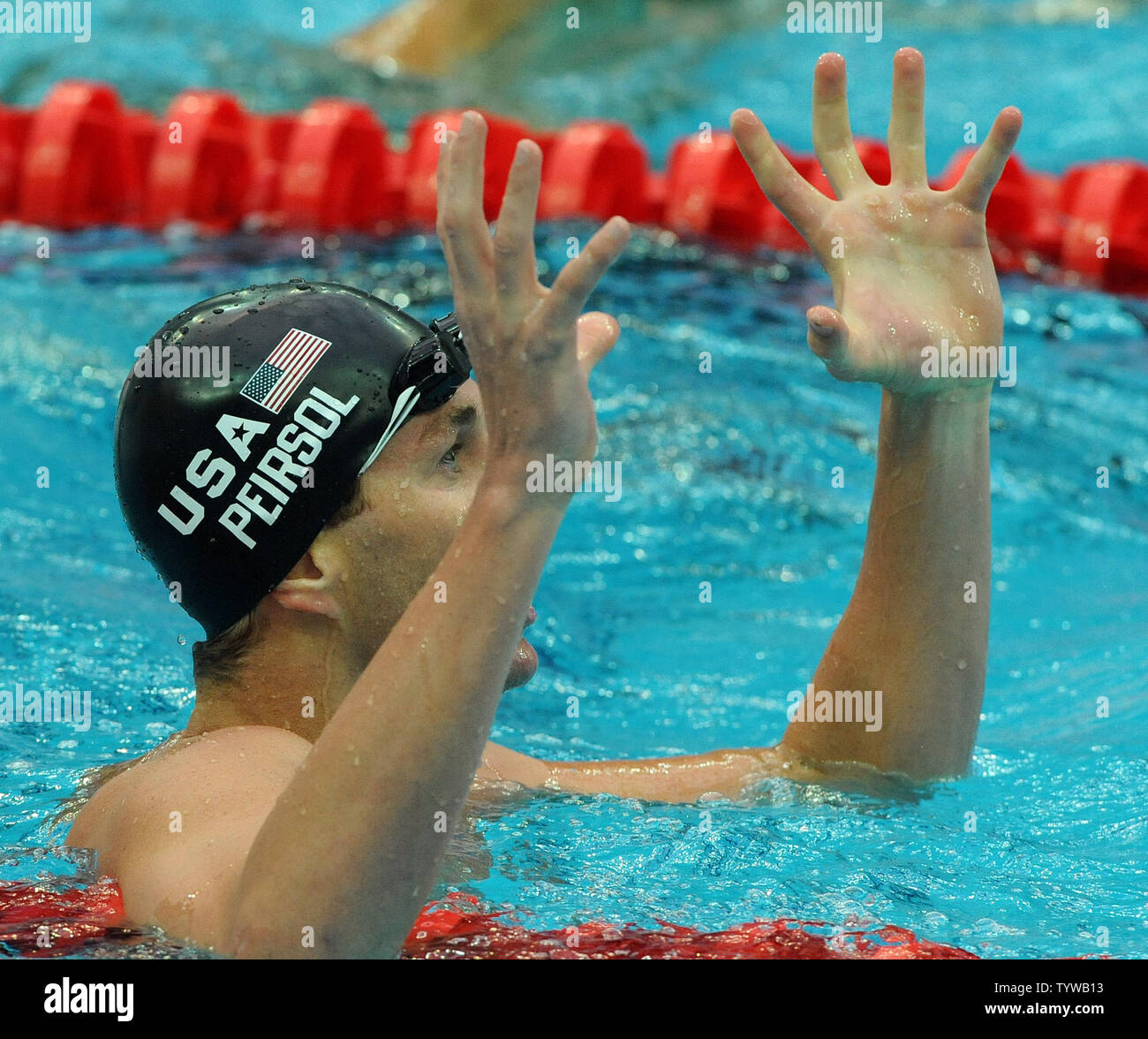 USA's Aaron Peirsol realizes he just set a world record, winning a gold ...