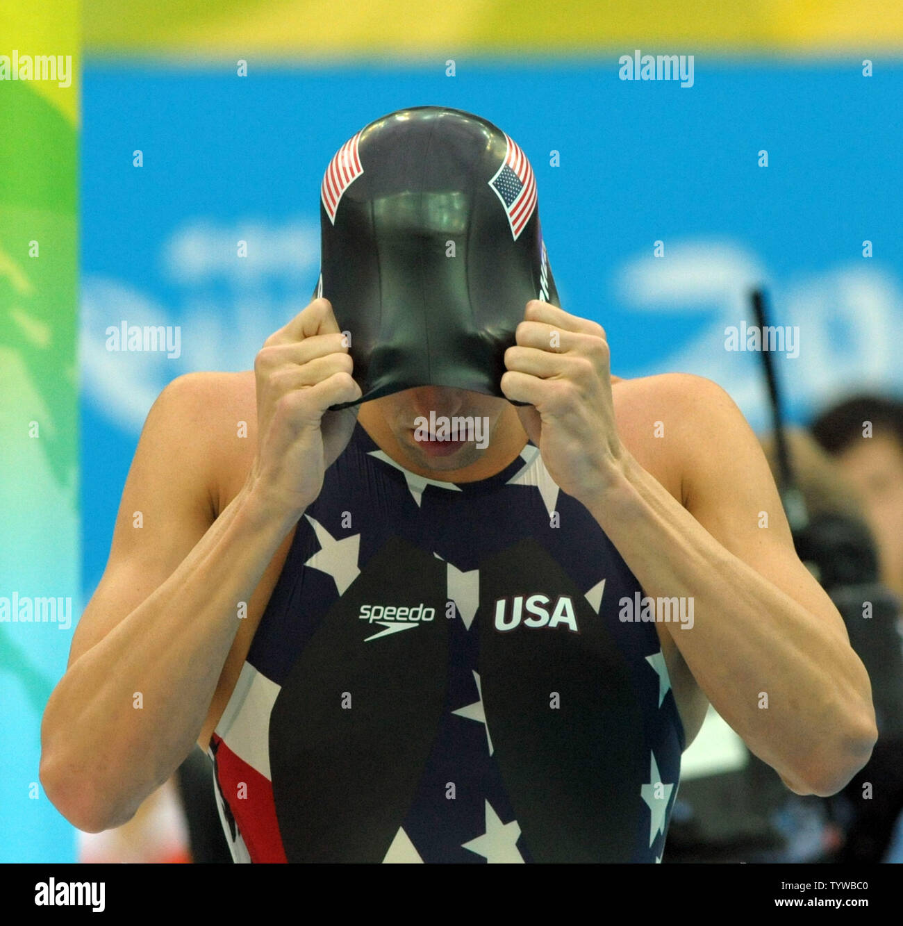 USA's Michael Phelps adjusts his swim cap before the Men's 4x200M ...