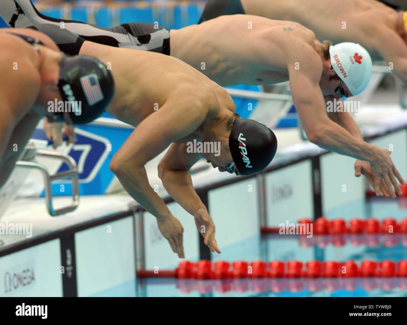 Japan's Kosuke Kitajima dives in to start the Men's 200M Breaststroke ...
