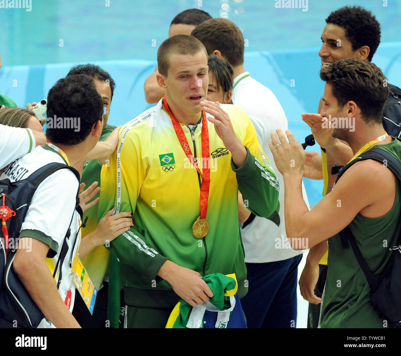 Brazilian Cesar Cielo Filho, surrounded by team mates, tears up after ...