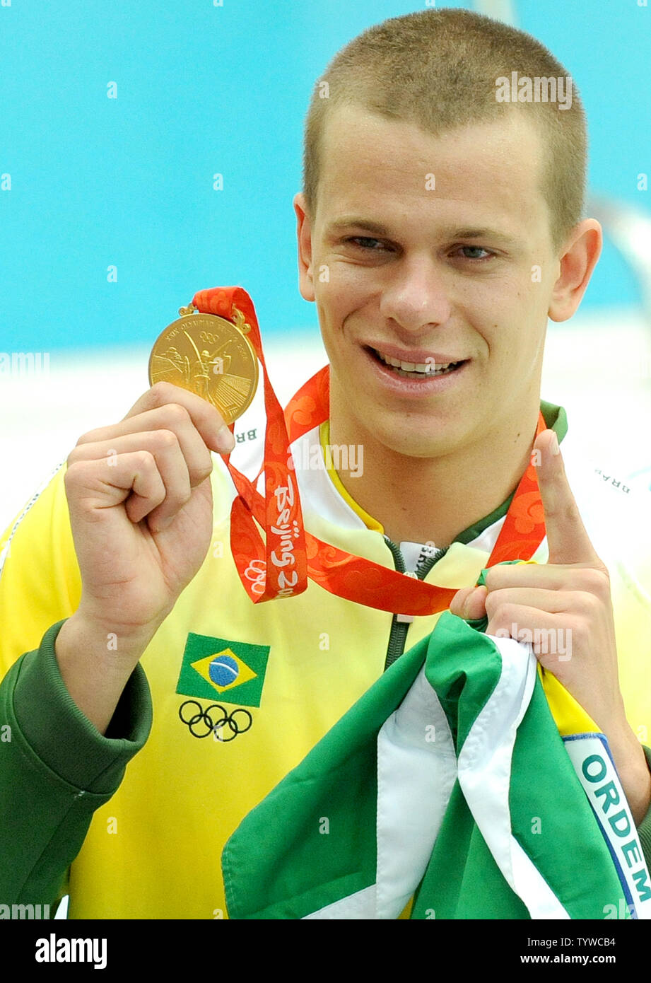Brazilian Cesar Cielo Filho shows off the gold medal for his Olympic ...