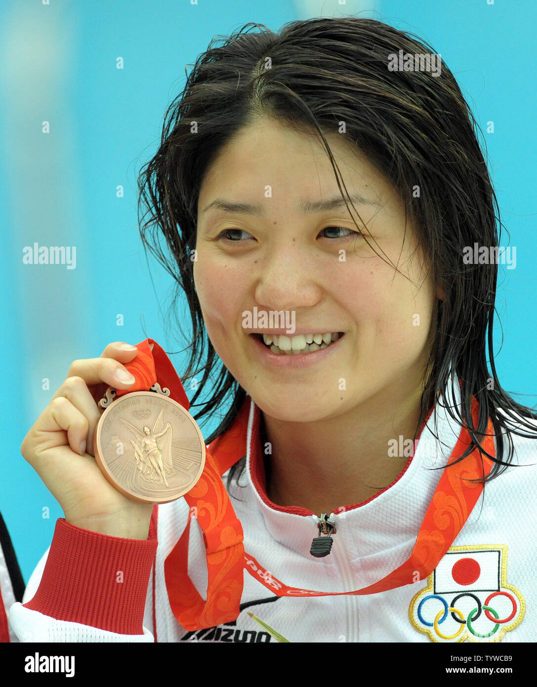 Japan's Reiko Nakamura shows her bronze medal won for the Women's 200M Backstroke at the ...