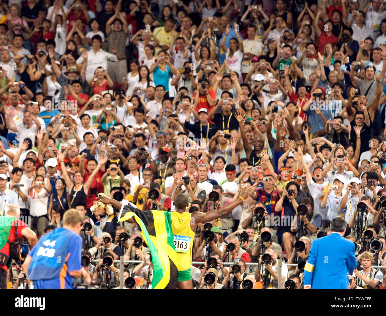 Jamaica's Usain Bolt jubilates with an adoring crowd after smashing the ...