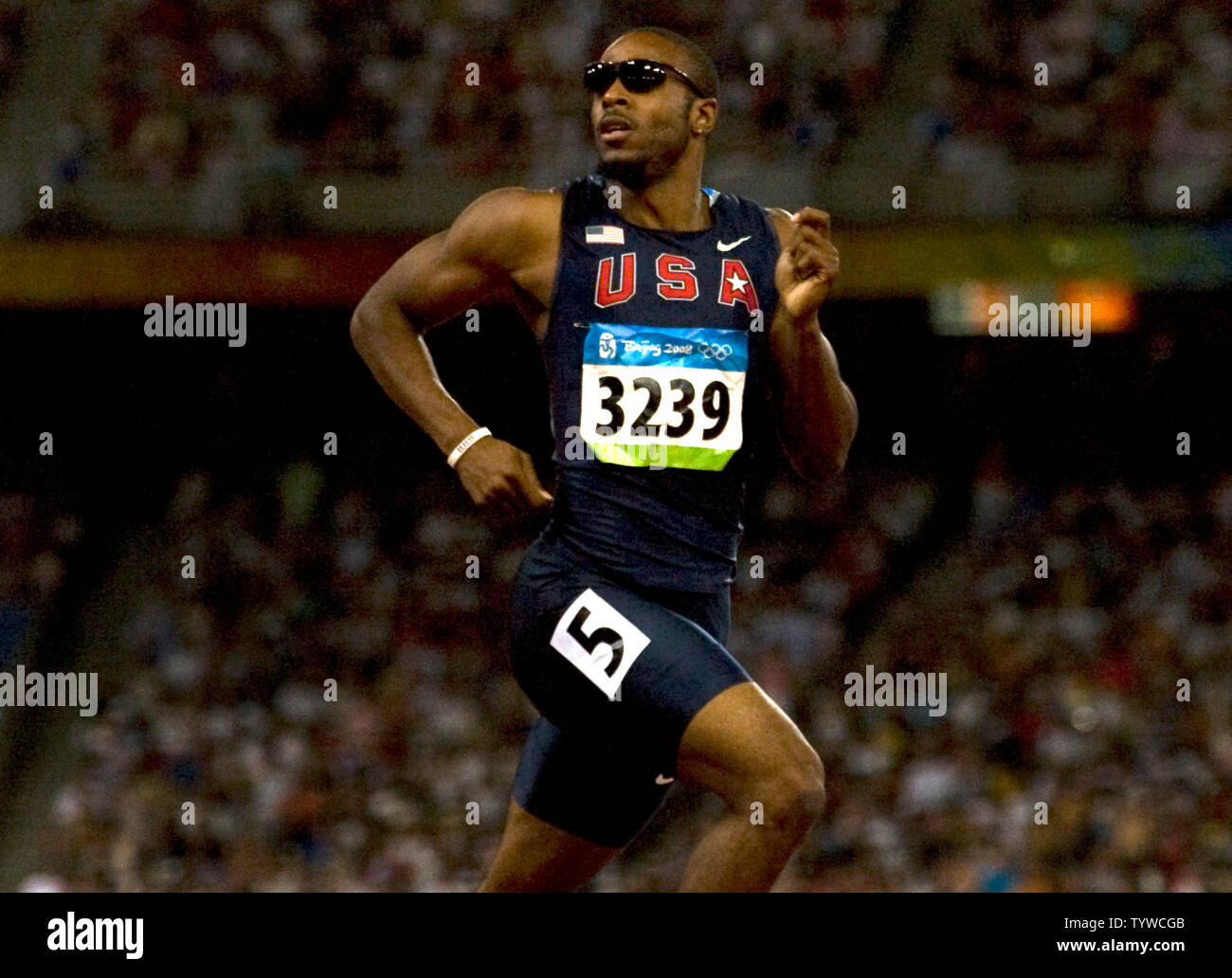 USA's Angelo Taylor sprints across the finish line to finish first in ...