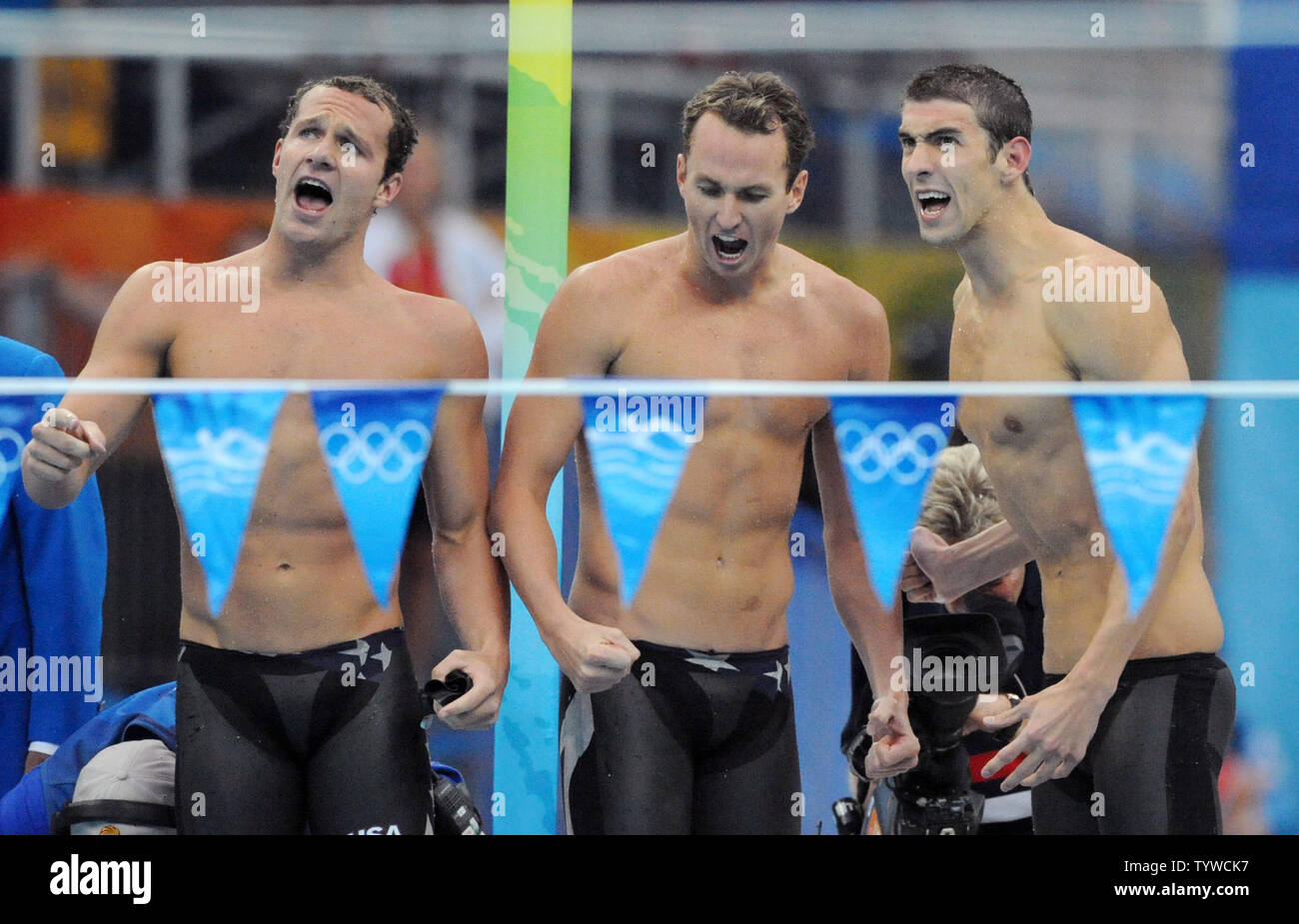 USA's team members Brendan Hansen (L) and Aaron Peirsol (C) and Michael ...