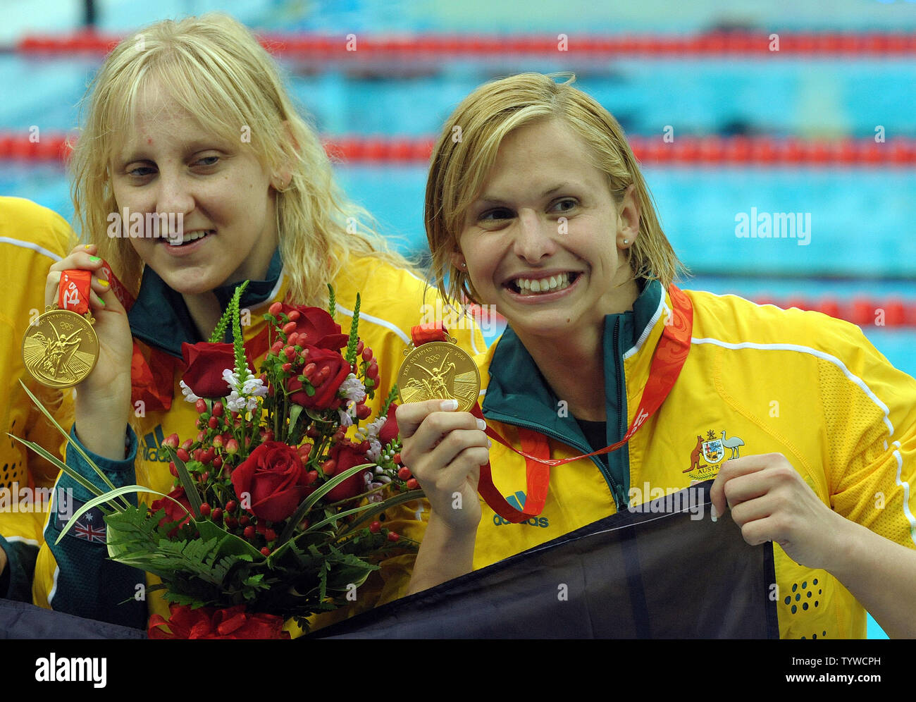 Australia's Jessicah Schipper and Lisbeth Trickett (L to R) show their gold medals won in the ...