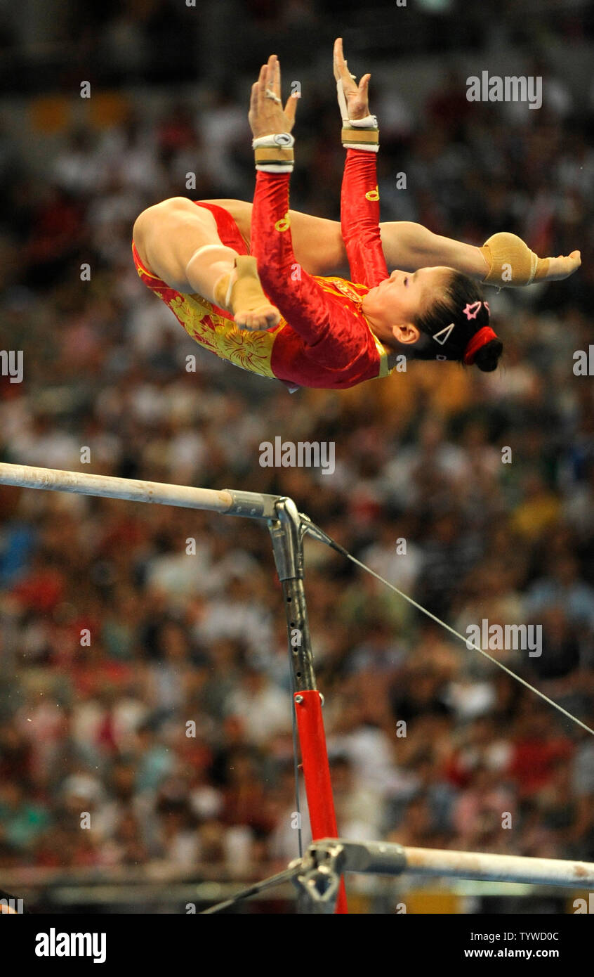 Chinese gymnast He Kexin performs her routine on the uneven bars during ...