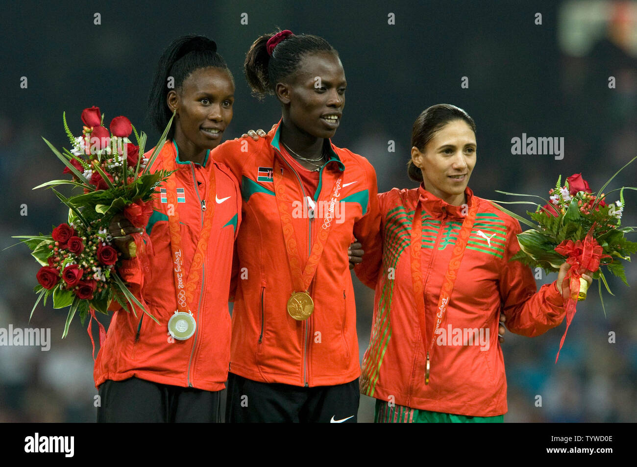 Gold medal winner Kenya's Pamela Jelimo (C) stands atop a podium with ...