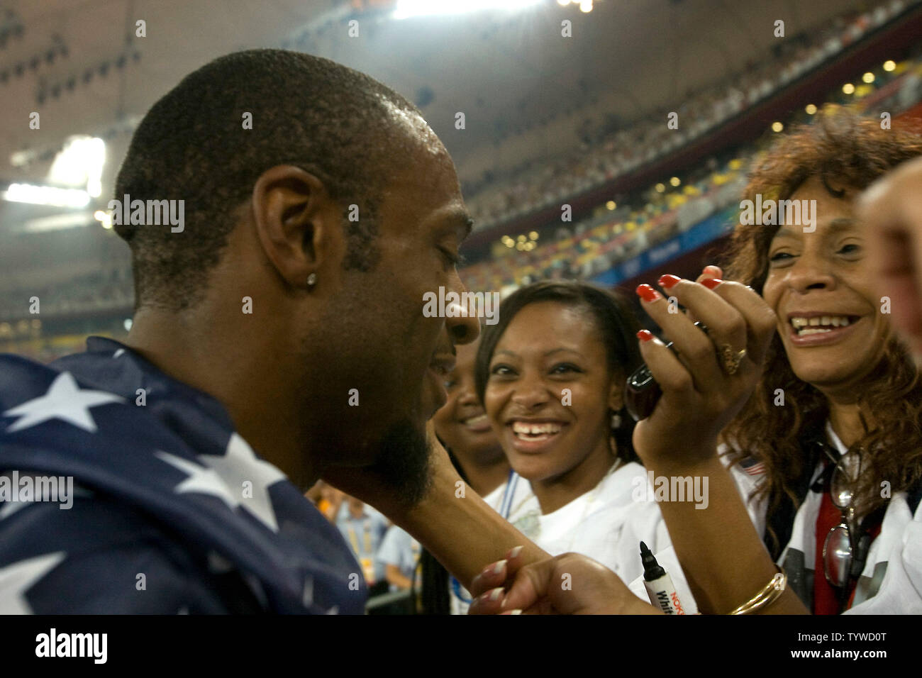 USA's Angelo Taylor meets his mother Sabrena in the stands after ...