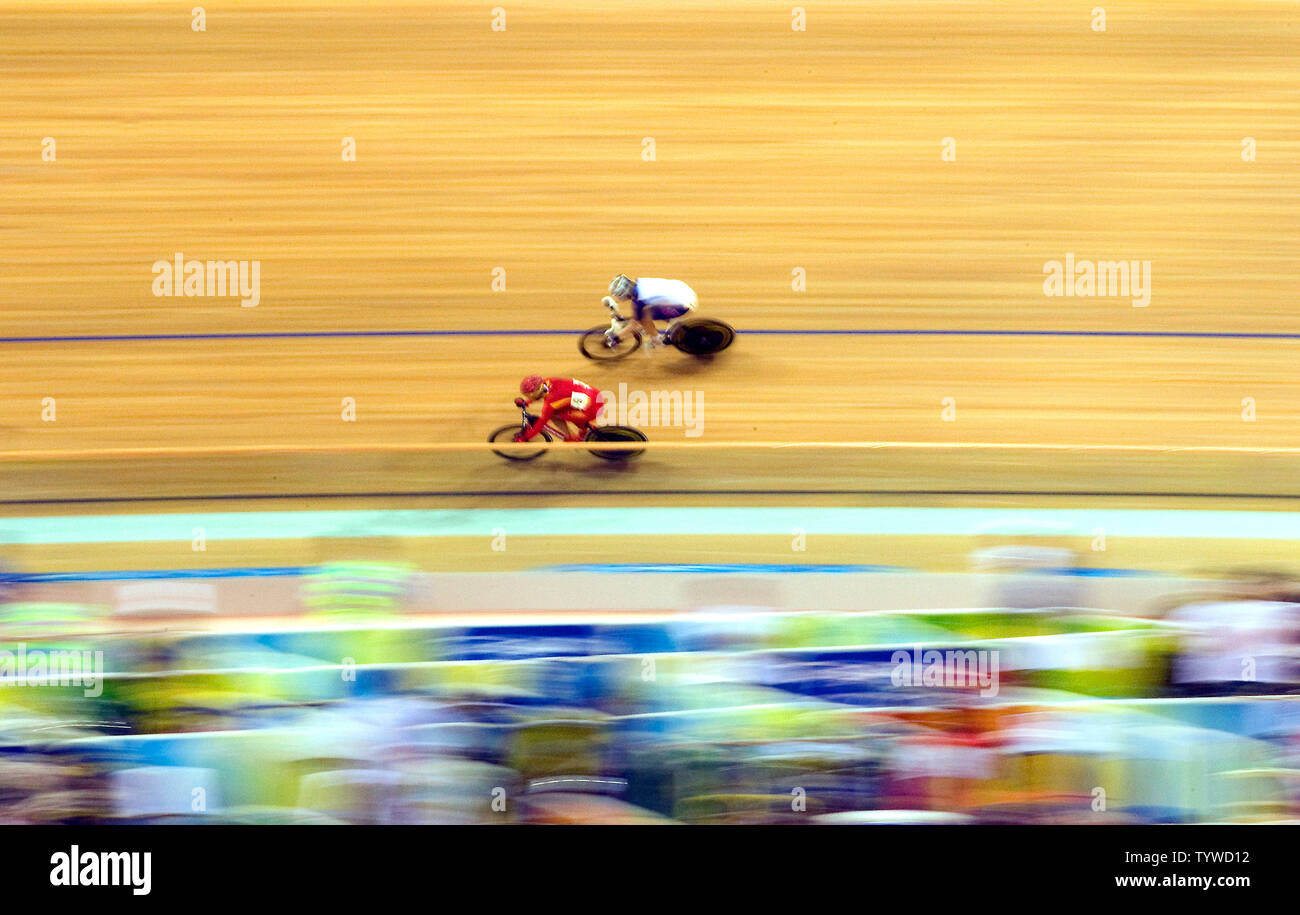 Cyclists sprint during the 100-lap Olympic women's point's race final ...