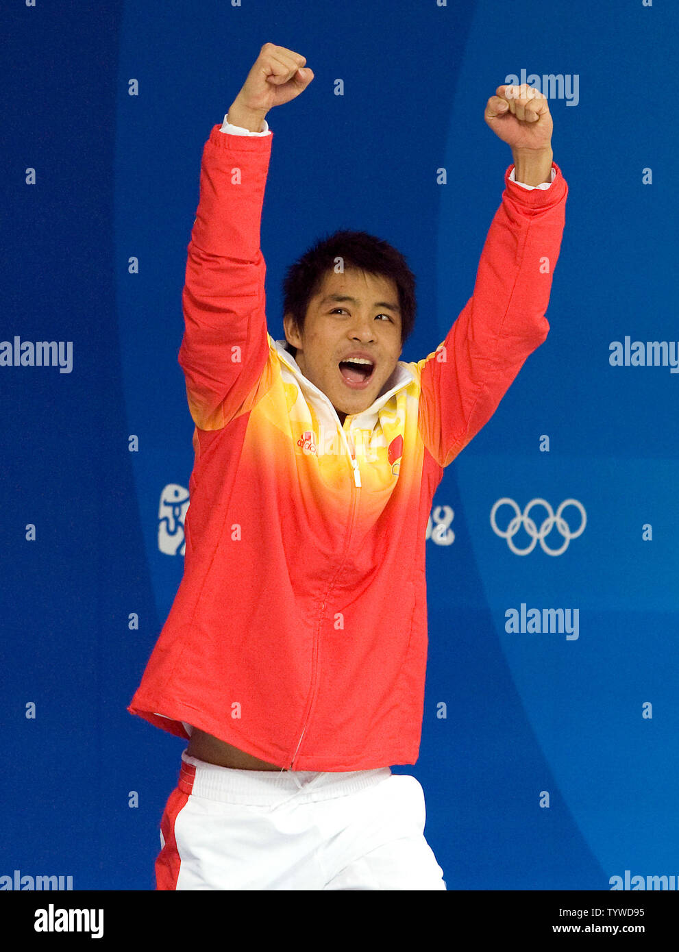 Gold medalist China's He Chong jubilates during the Olympic Men's 3M ...