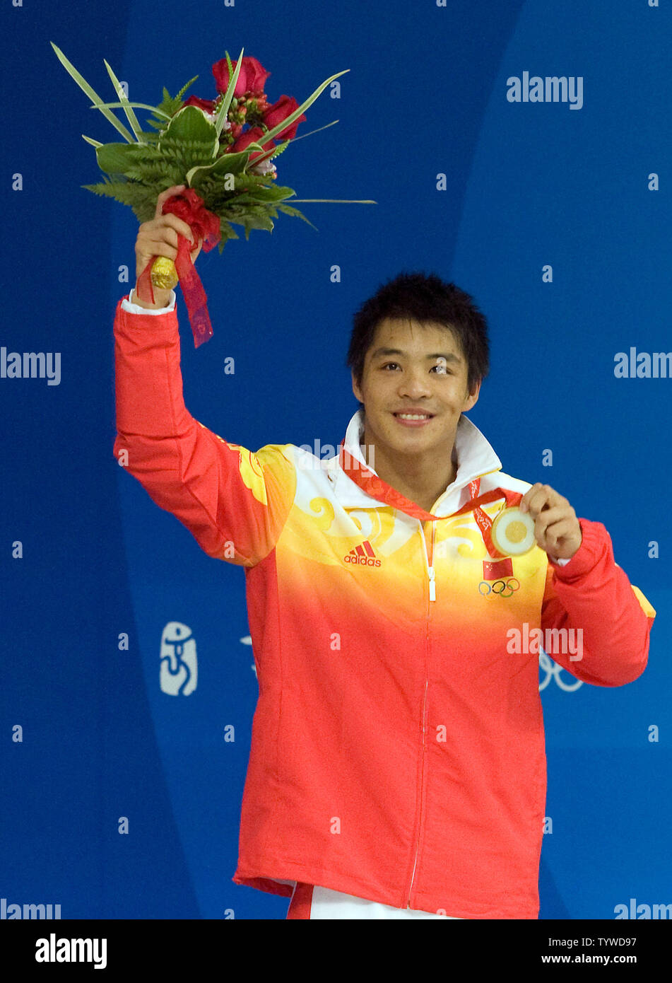 Gold medalist China's He Chong jubilates during the Olympic Men's 3M ...