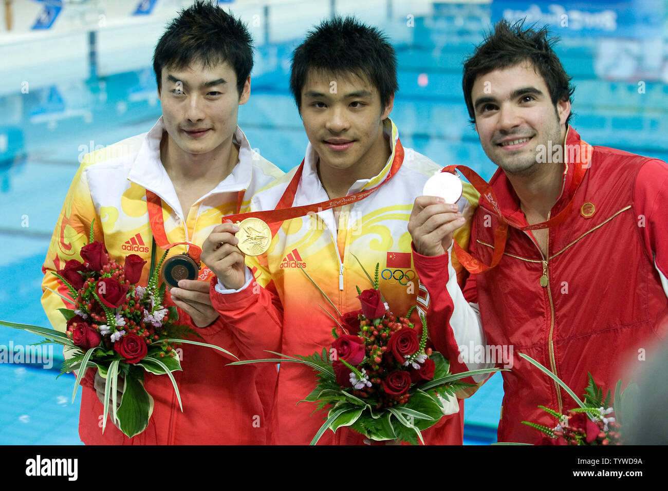 Gold medalist China's He Chong (C), silver medalist Canada's Alexandre ...