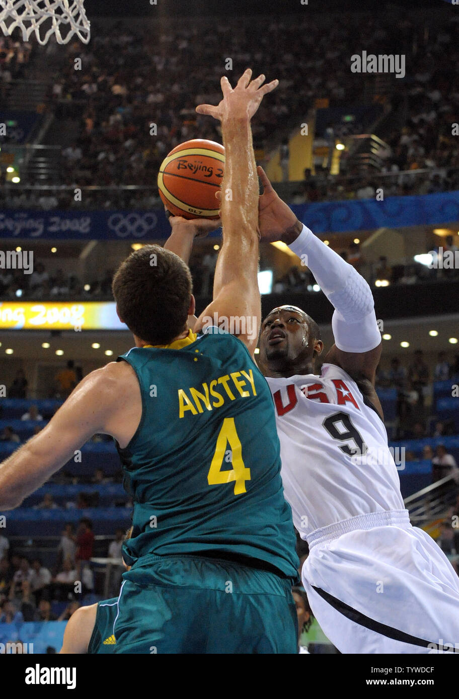 USA's Dwyane Wade tries to shoot over Australia's Chris Anstey in the ...