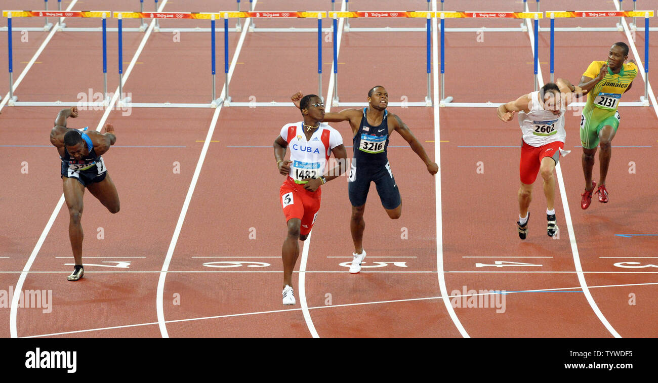 Cuba's Dayron Robles looks at the score board after winning the Men's ...