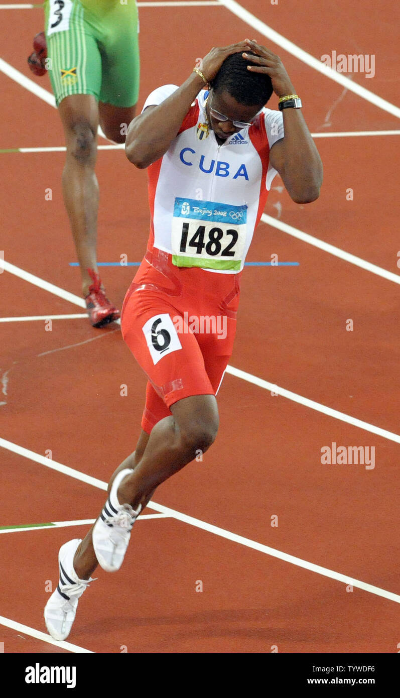 Cuba's Dayron Robles celebrates after winning the Men's 110M Hurdles at ...