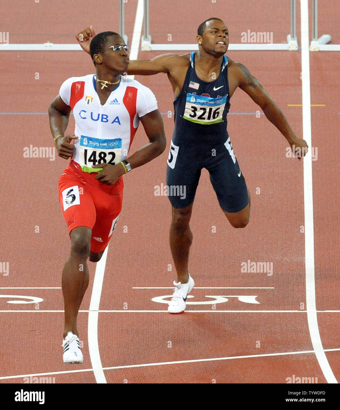 Cuba's Dayron Robles looks up at the score board after winning the Men ...