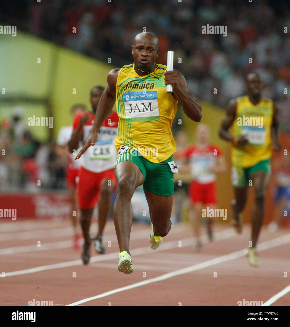 Anchor Asafa Powell races to the finish in the men's 4x100m relay final ...