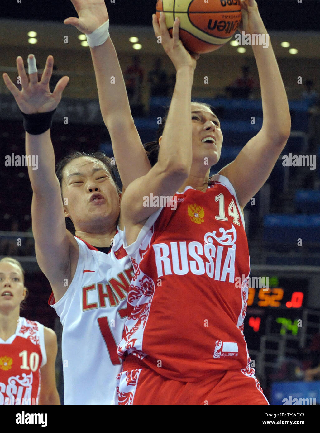 Russia's Svetlana Abrosimova gets by China's Chen Xiaoli to take a shot ...