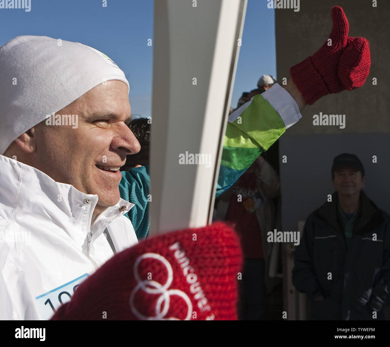 Torch bearer Mike Marcoux from Surrey runs the New Westminster Quay and ...