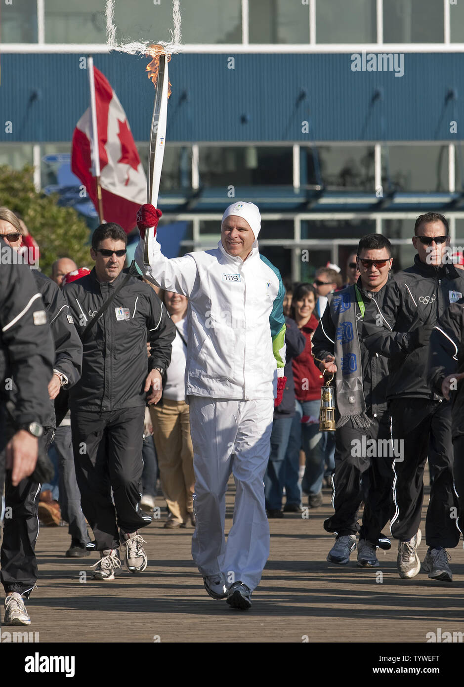 Torch bearer Mike Marcoux from Surrey runs the New Westminster Quay and ...