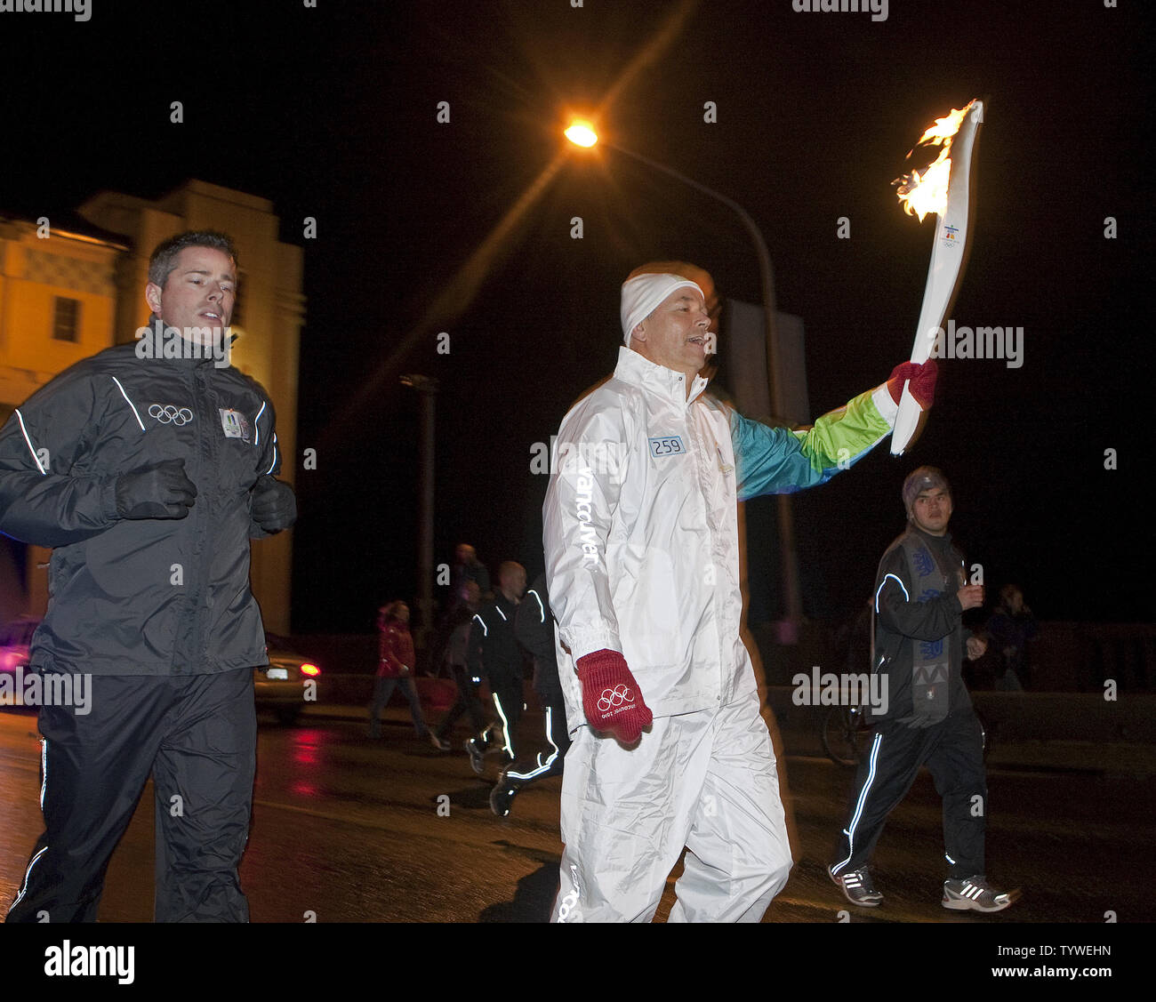 A torch bearer carries the olympic flame hi-res stock photography and images - Alamy