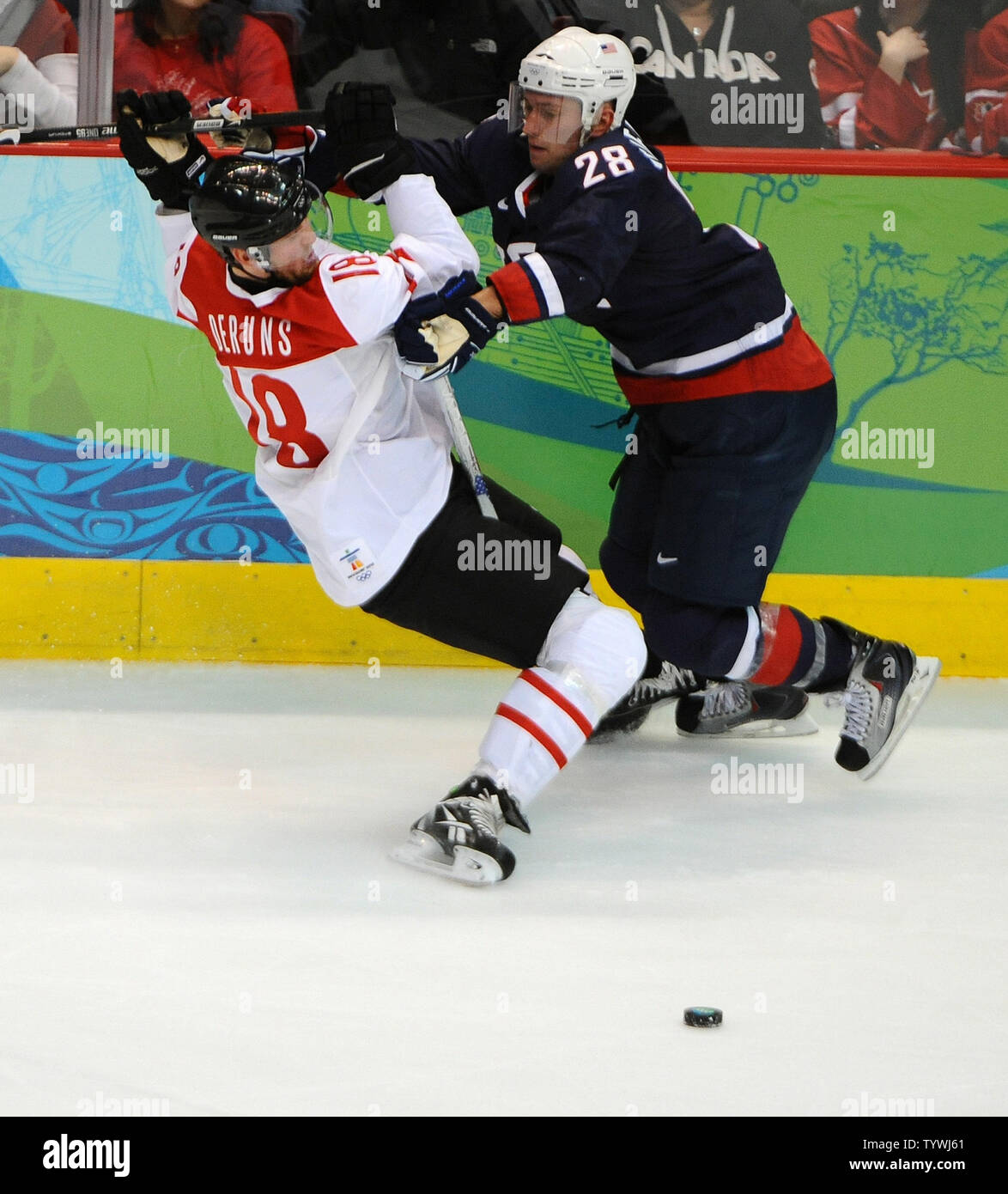 USA's Brian Rafalski hits Switzerland's Thomas Deruns during the second ...