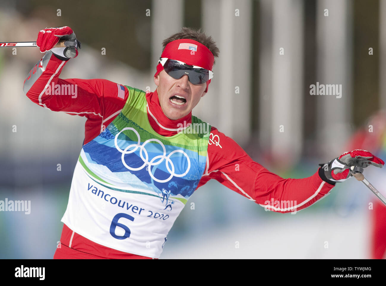 The USA's Bill Demong celebrates winning gold after crossing the finish ...