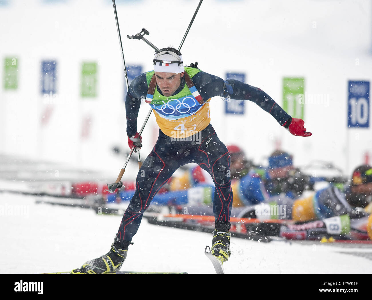 France's Simon Fourcade skis on course after finishing his first lap ...