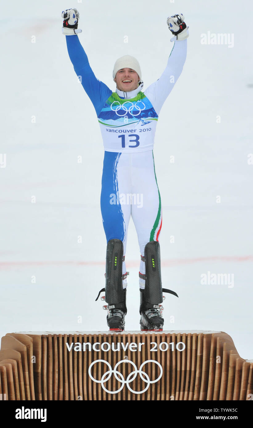 Gold medalist Italy's Giuliano Razzoli celebrates during the flower ...