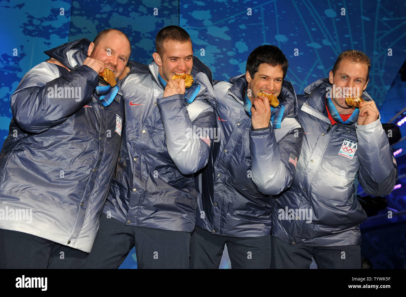 The USA's four-man bobsled team celebrates with their gold medals ...