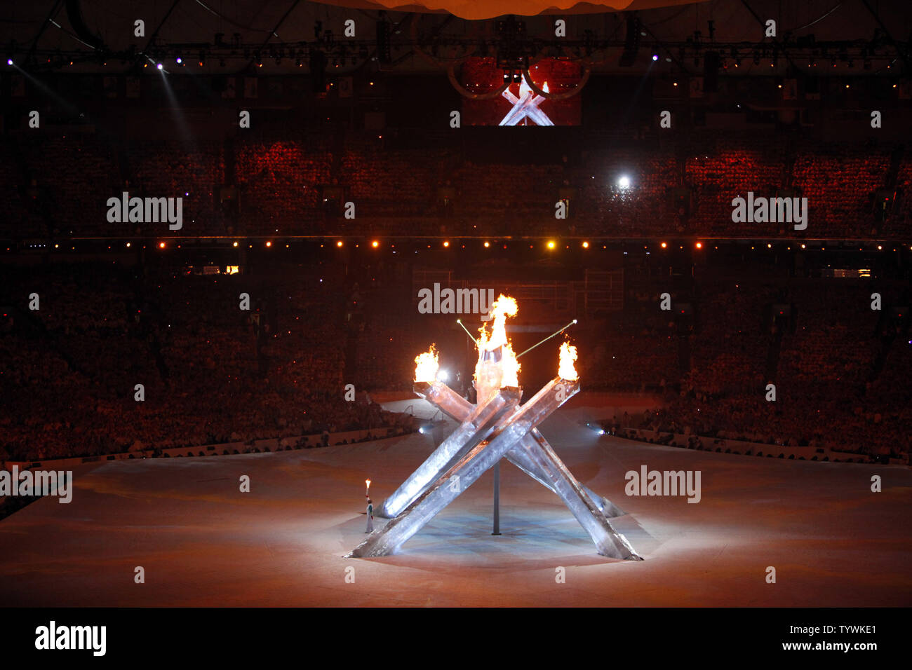 The Olympic Flame is lit during the Closing Ceremony at BC Place in ...