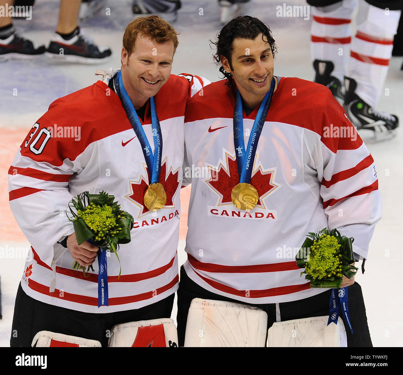 Canada's Roberto Luongo (R) and Martin Brodeur celebrate their medals ...