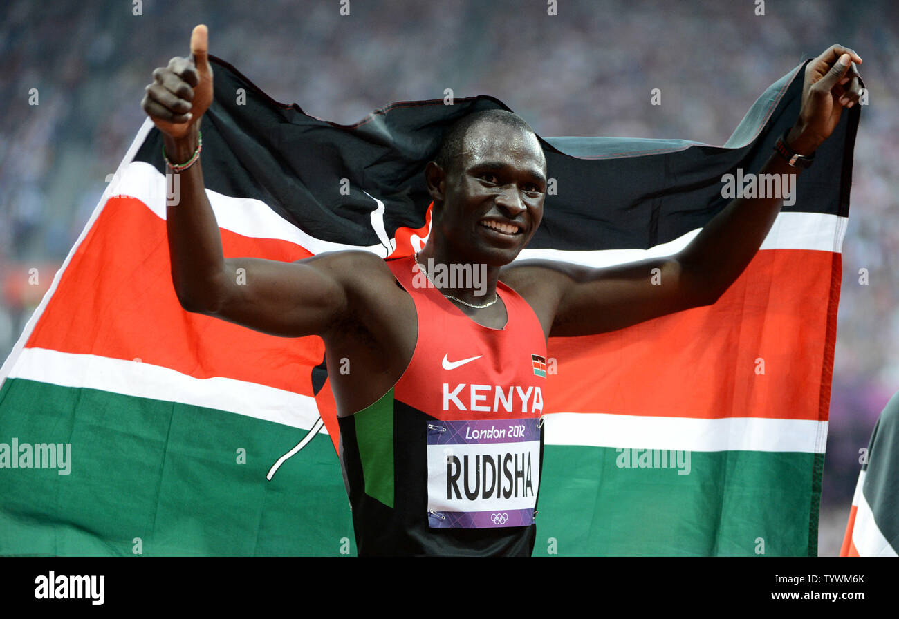 Kenya's David Lekuta Rudisha holds his nation's flag as he wins the ...
